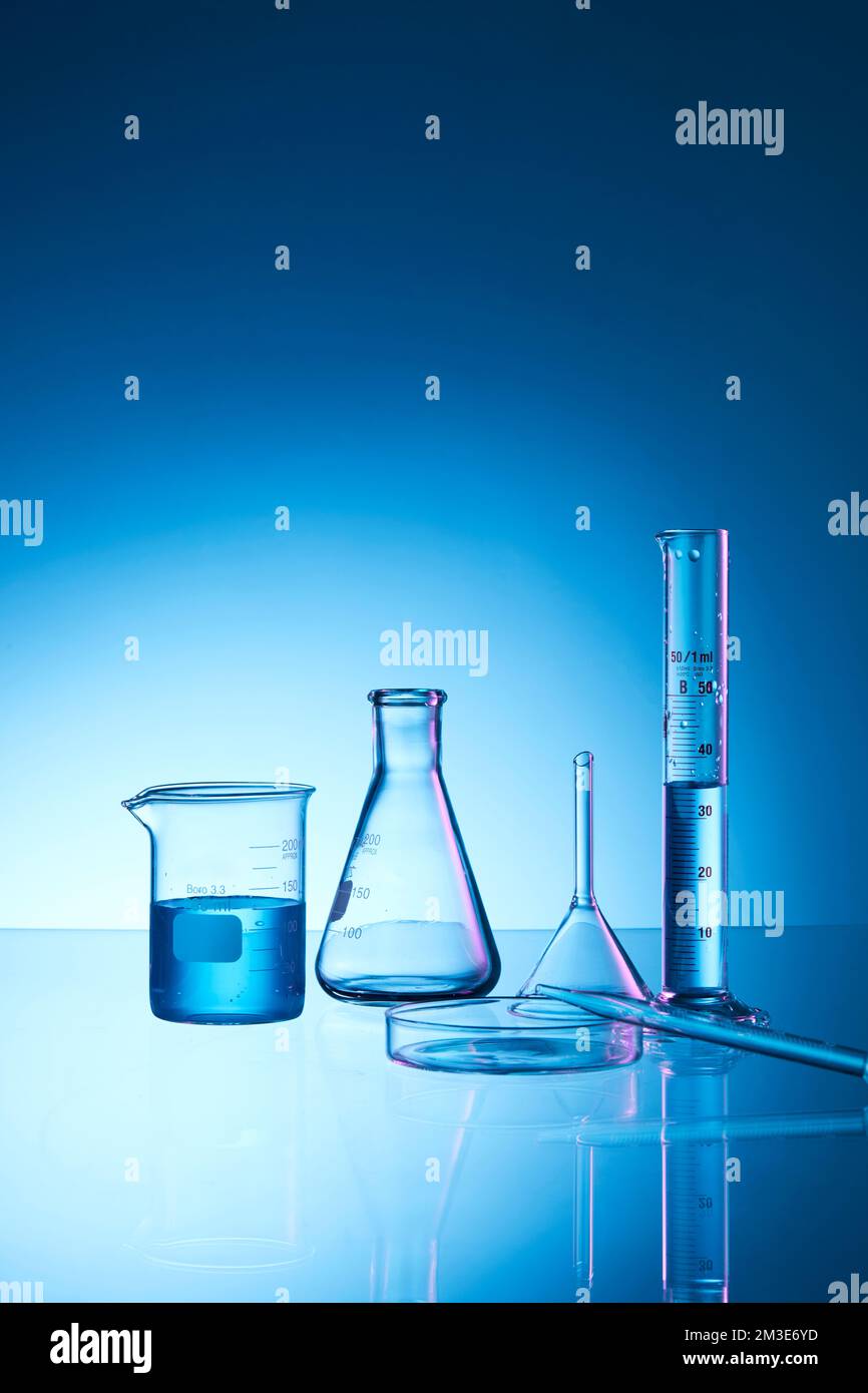 science lab with clear blue background and test tubes with blue ...