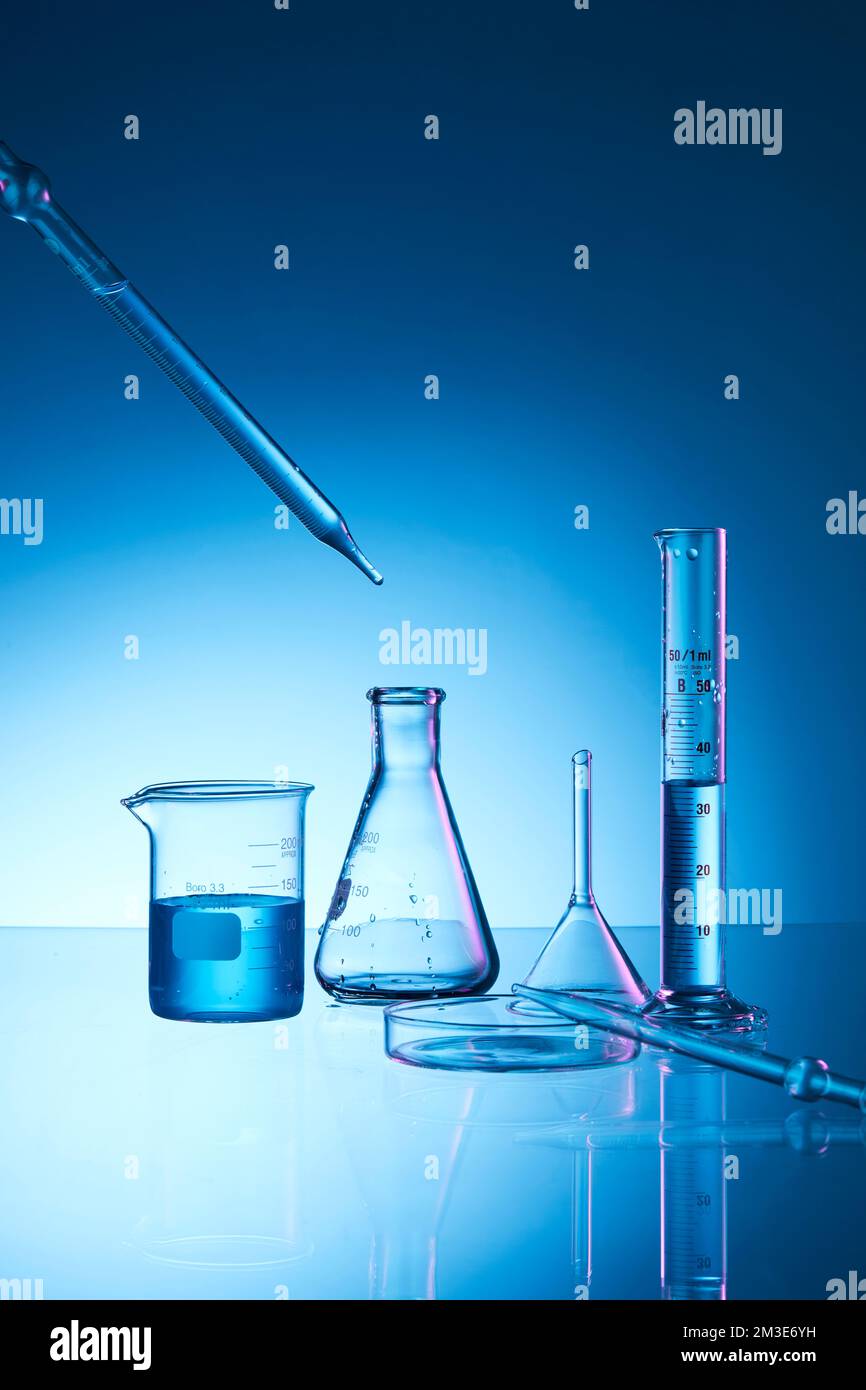 science lab with clear blue background and test tubes with blue ...