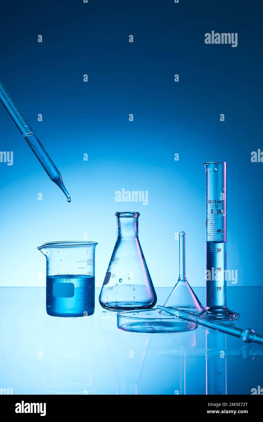 science lab with clear blue background and test tubes with blue ...