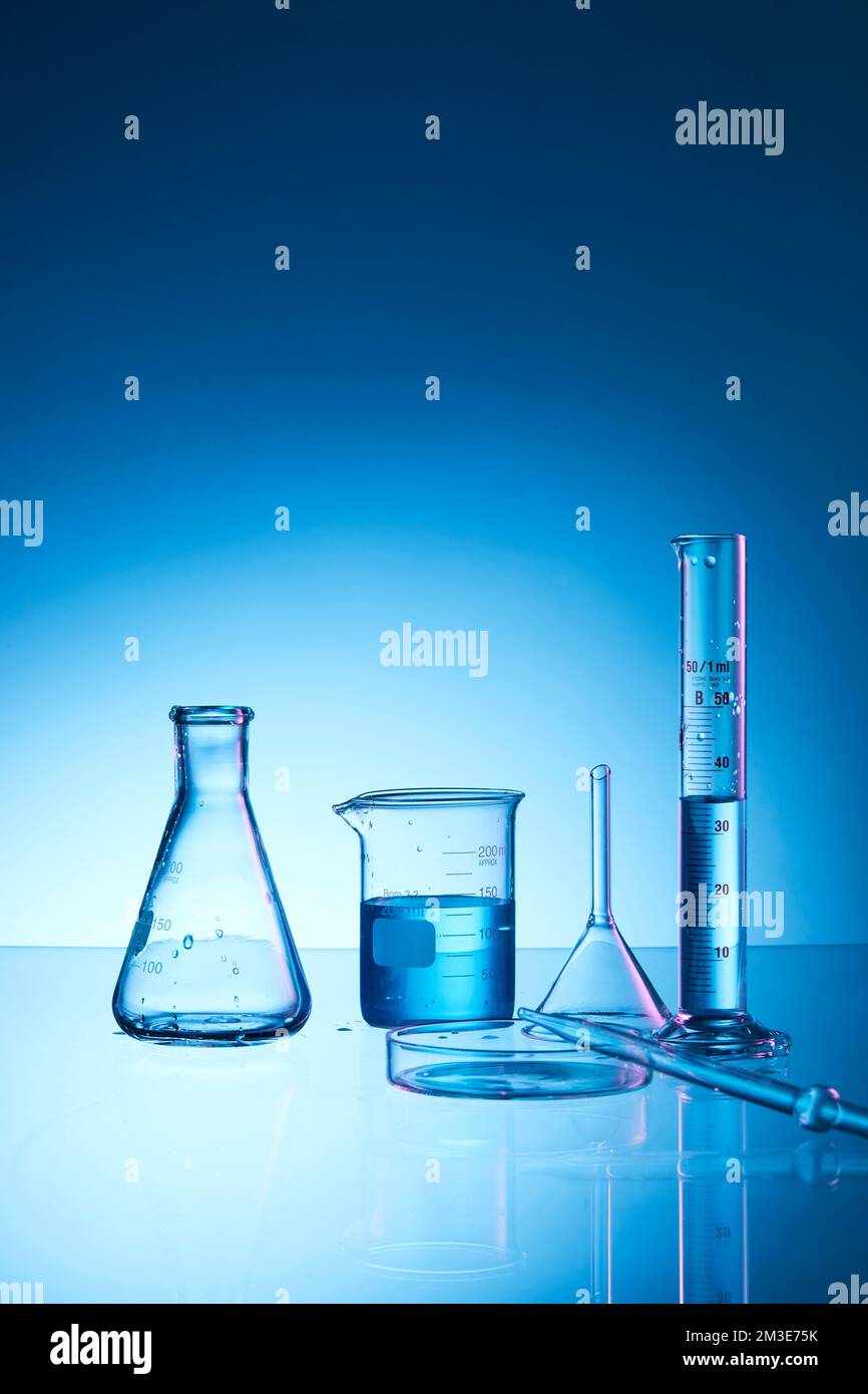 science lab with clear blue background and test tubes with blue ...