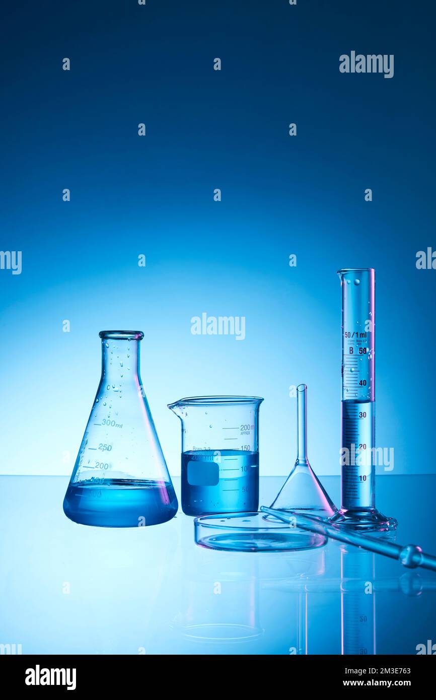 science lab with clear blue background and test tubes with blue ...