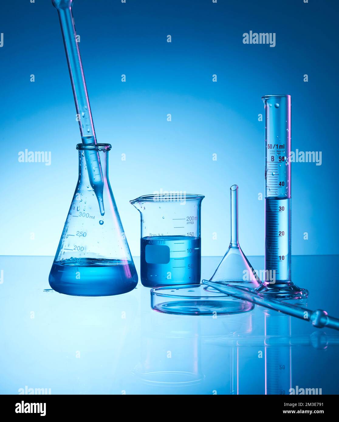 science lab with clear blue background and test tubes with blue ...