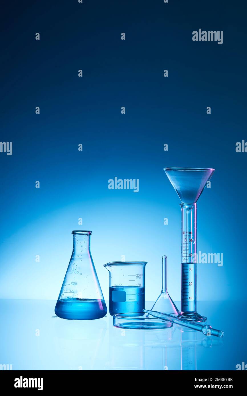 science lab with clear blue background and test tubes with blue ...