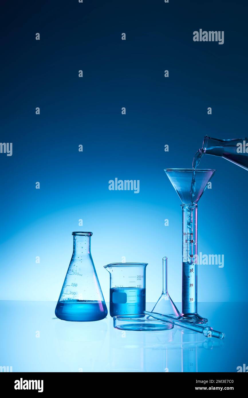 science lab with clear blue background and test tubes with blue ...