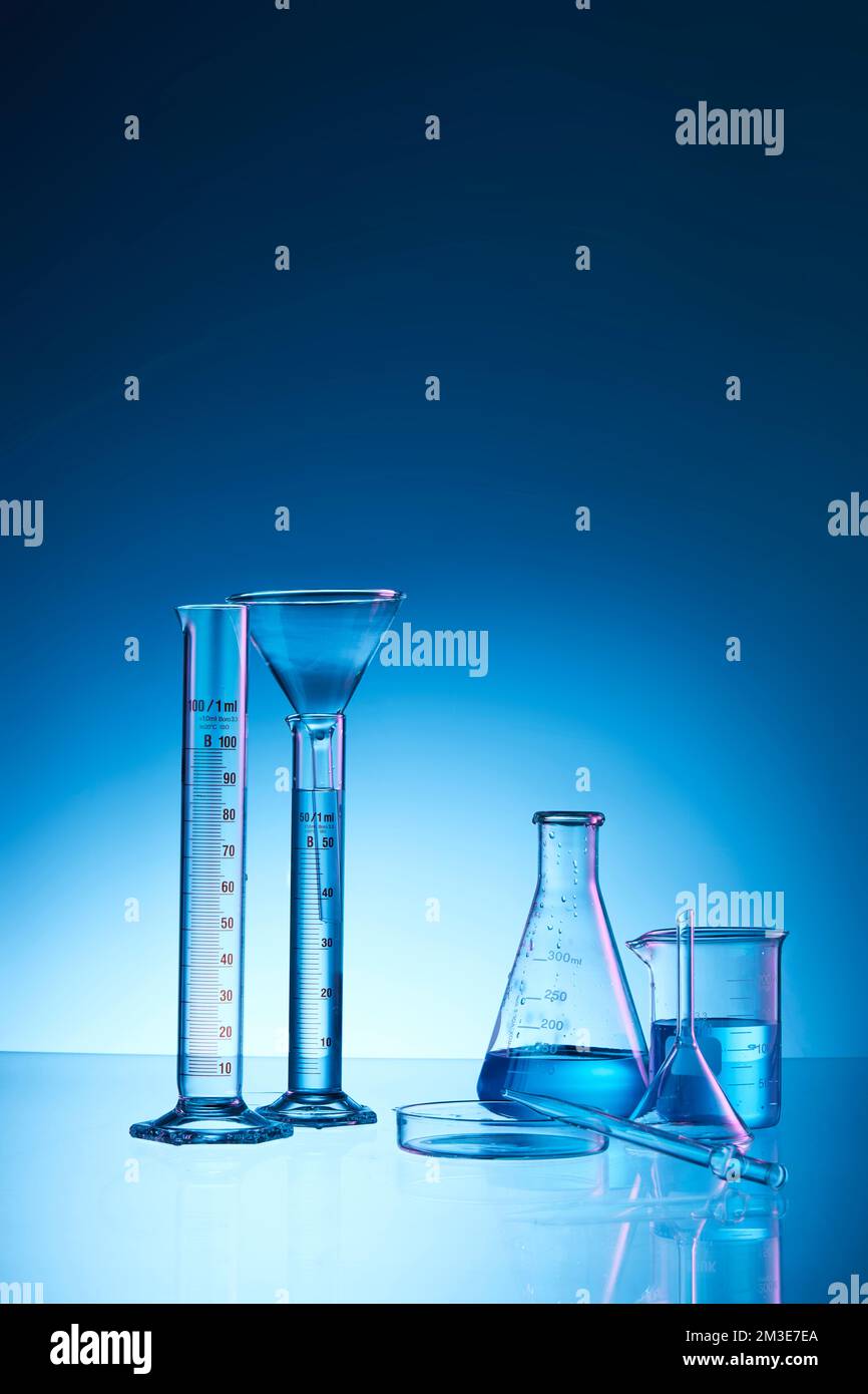 science lab with clear blue background and test tubes with blue ...
