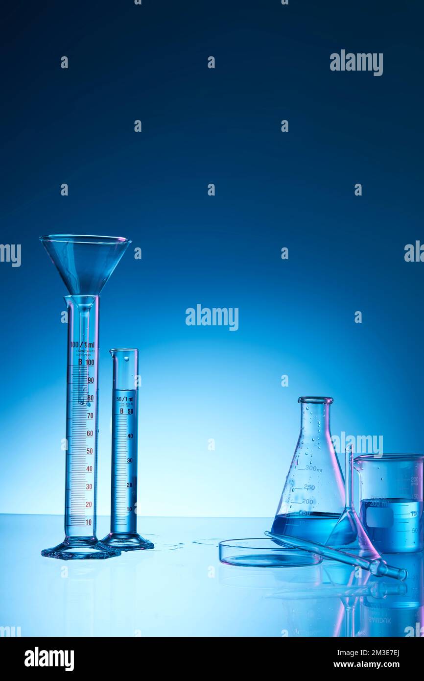 science lab with clear blue background and test tubes with blue ...