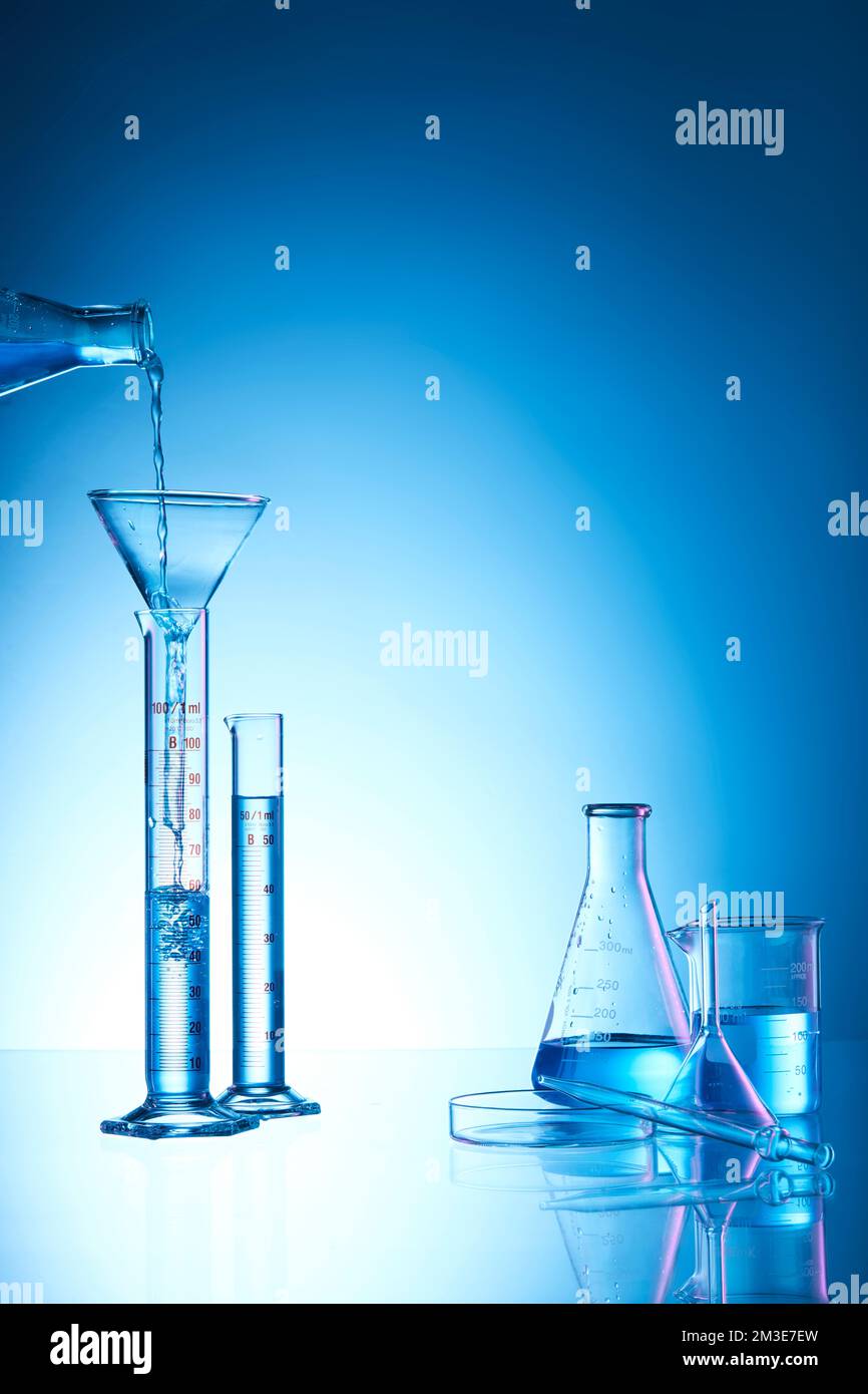 science lab with clear blue background and test tubes with blue ...