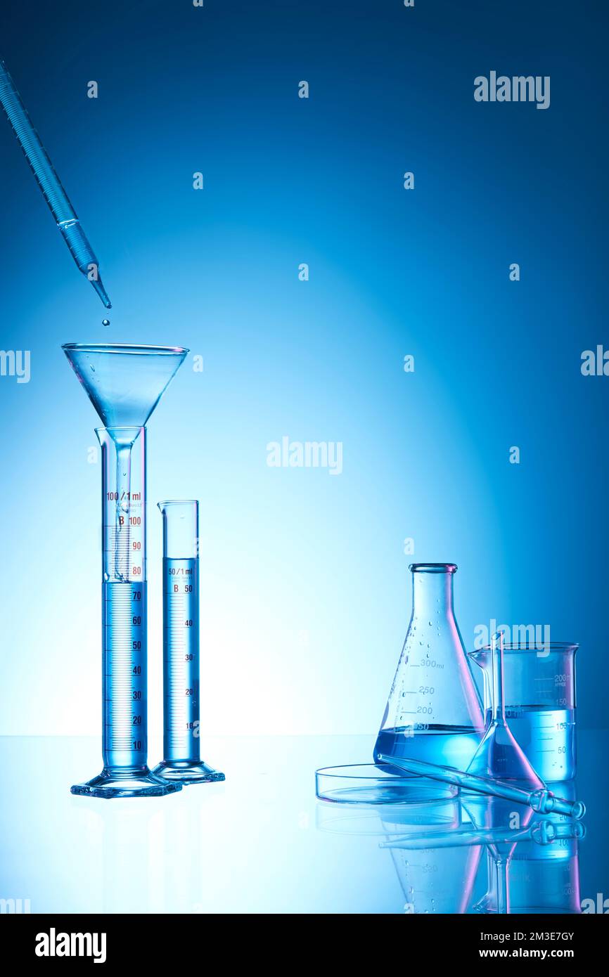 science lab with clear blue background and test tubes with blue ...