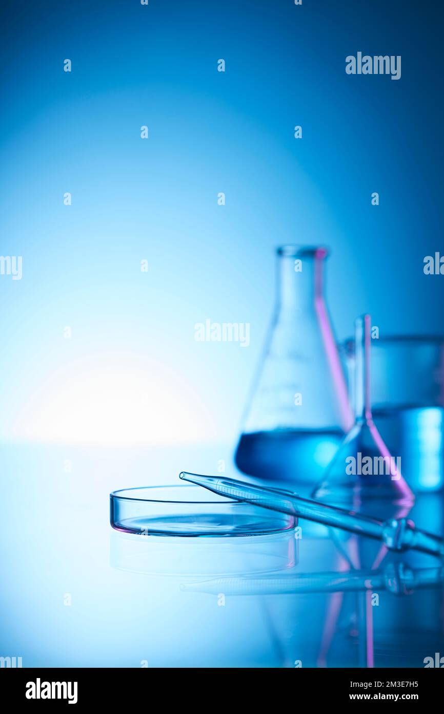 science lab with clear blue background and test tubes with blue ...