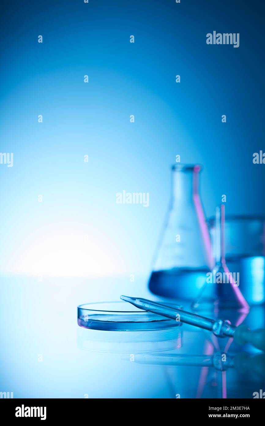 science lab with clear blue background and test tubes with blue ...