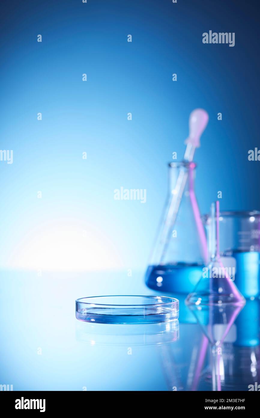science lab with clear blue background and test tubes with blue ...