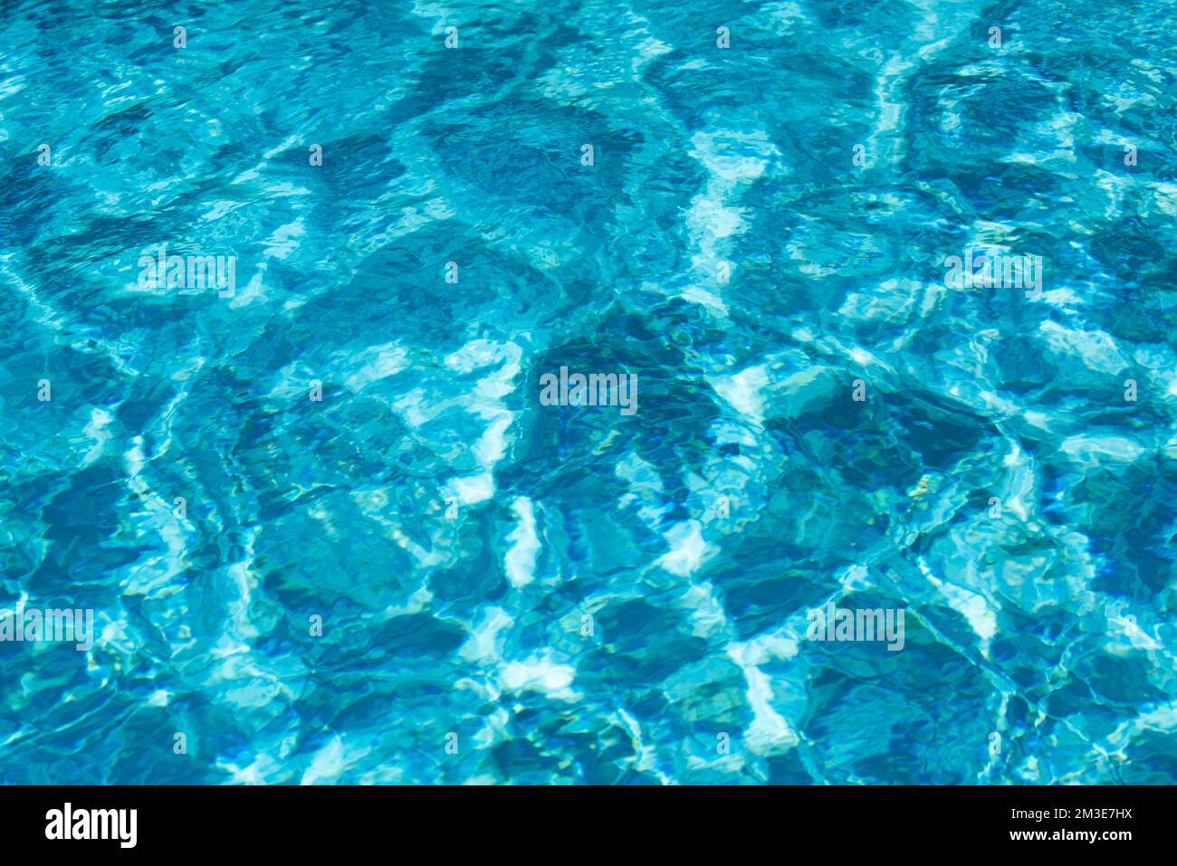Background of blue water in swimming pool with sun reflection, ripple ...
