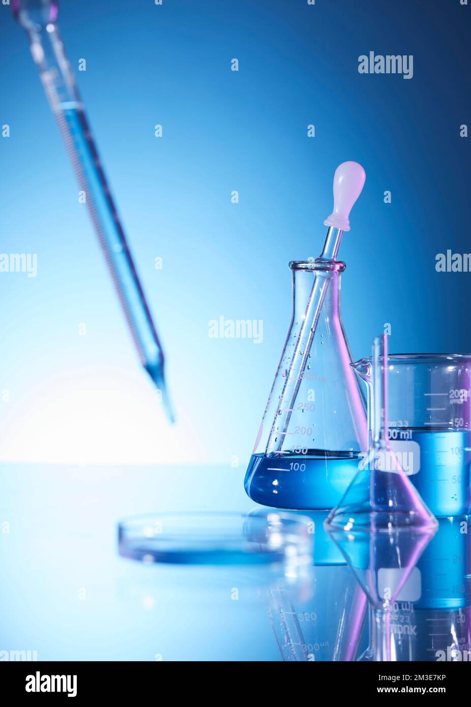 science lab with clear blue background and test tubes with blue ...