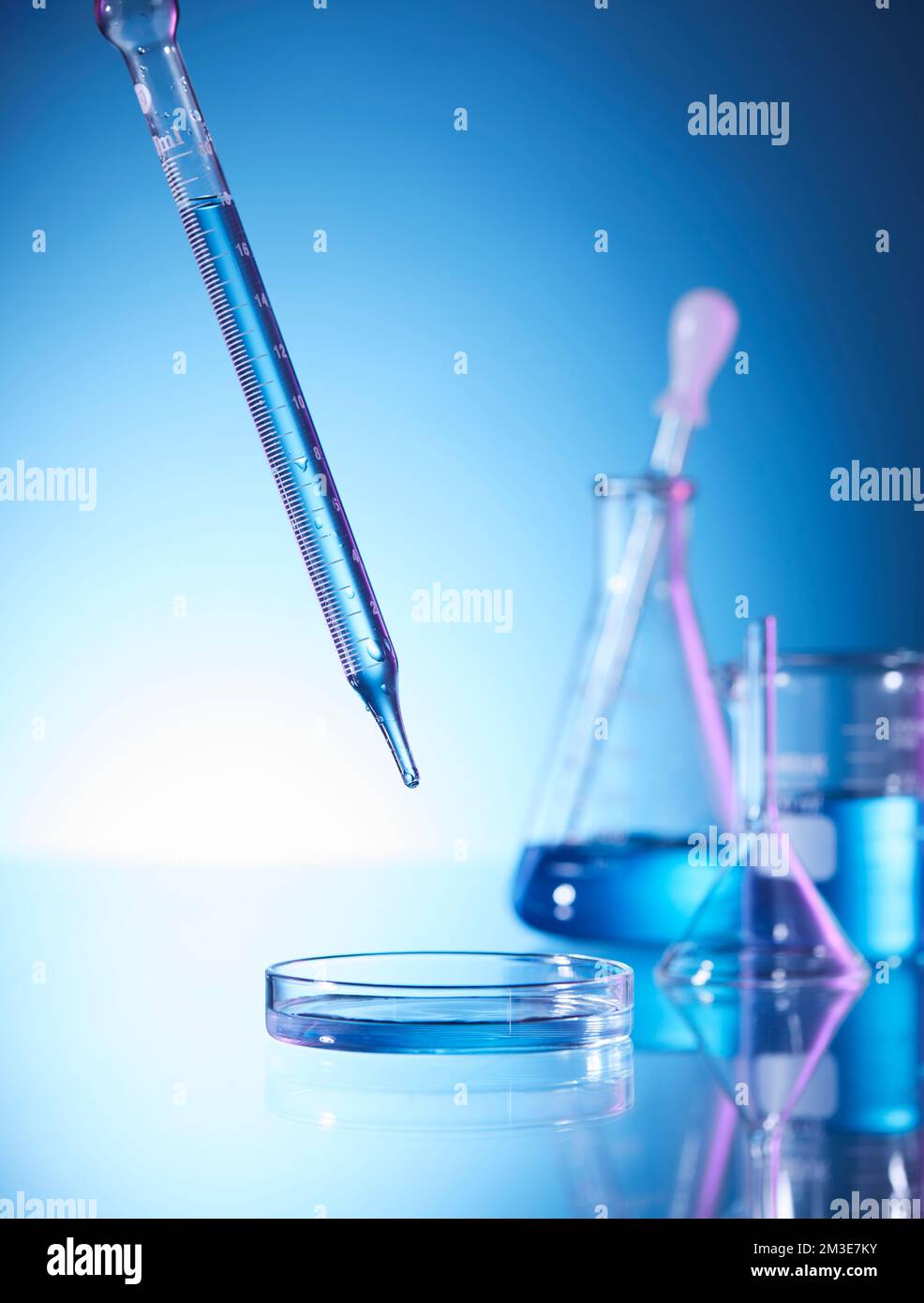 science lab with clear blue background and test tubes with blue ...