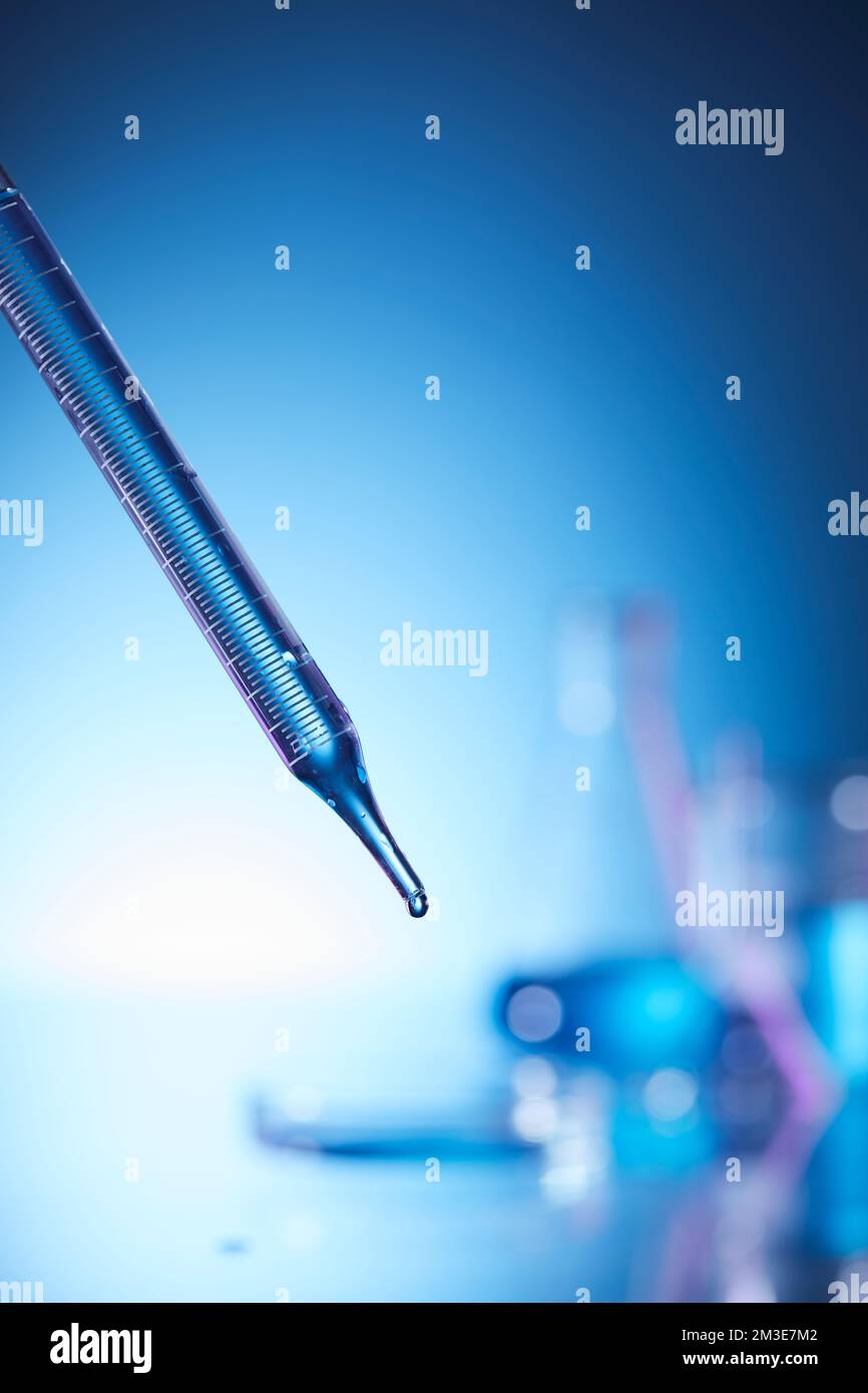 science lab with clear blue background and test tubes with blue ...