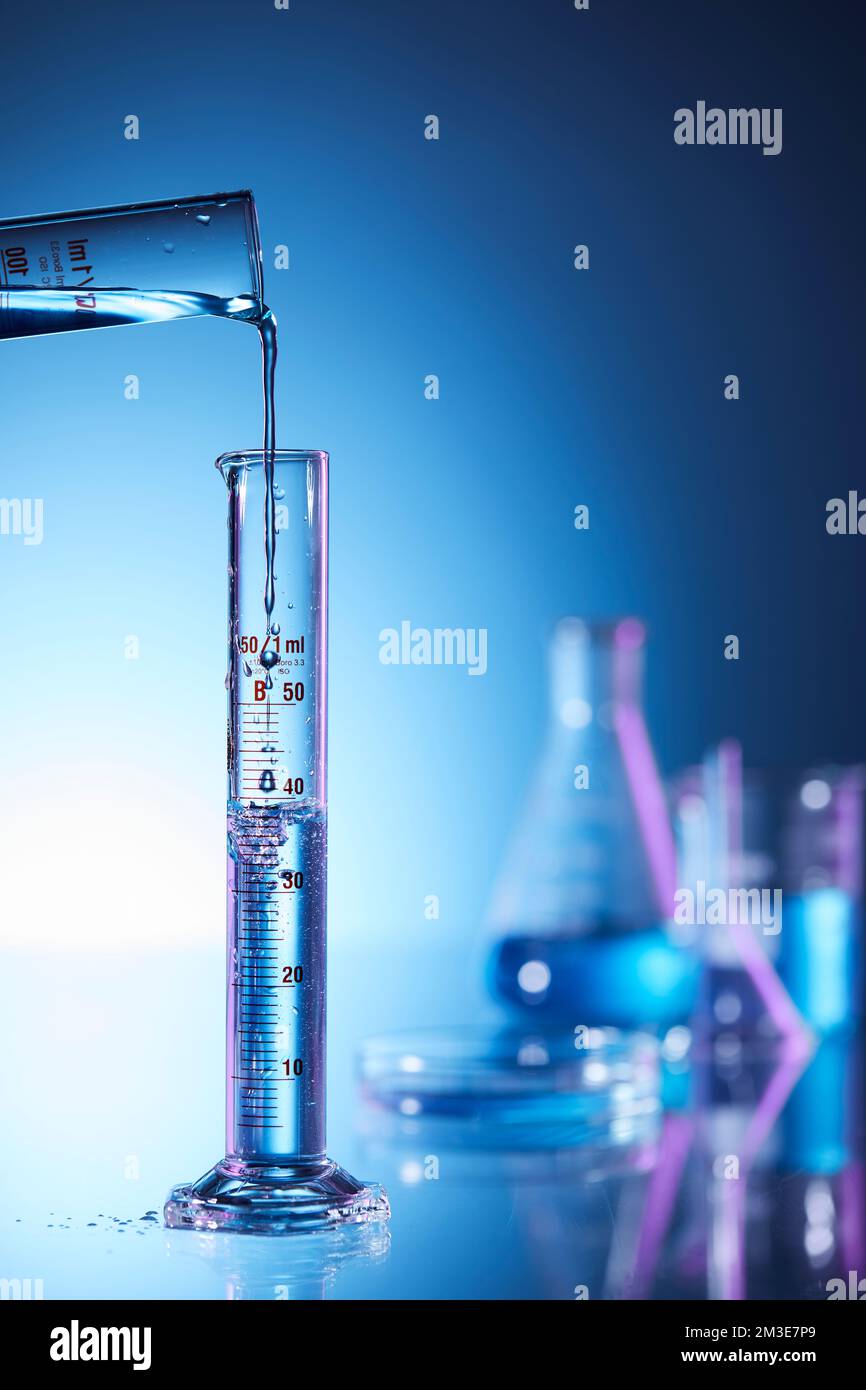 science lab with clear blue background and test tubes with blue ...