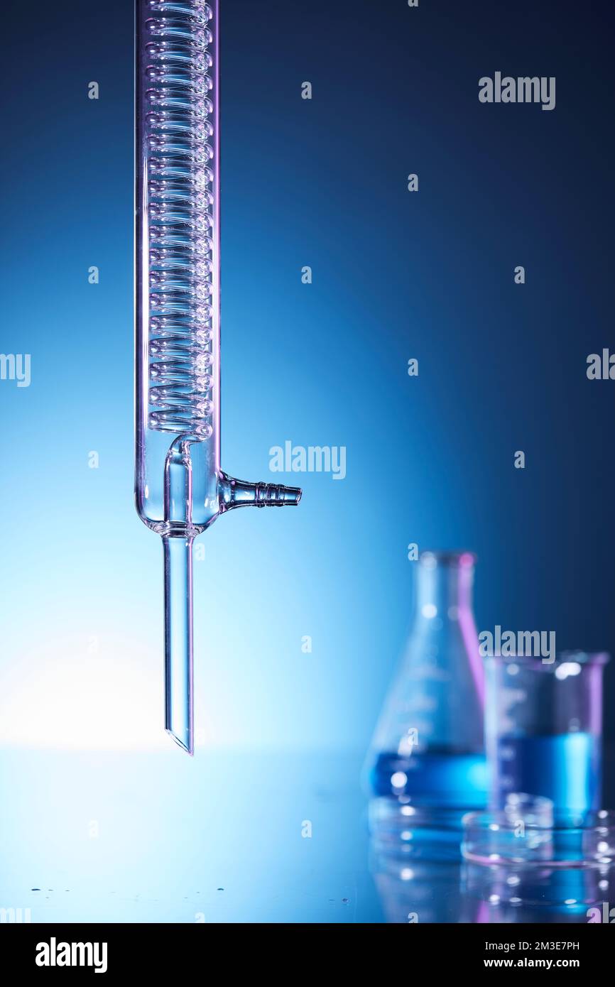 science lab with clear blue background and test tubes with blue ...