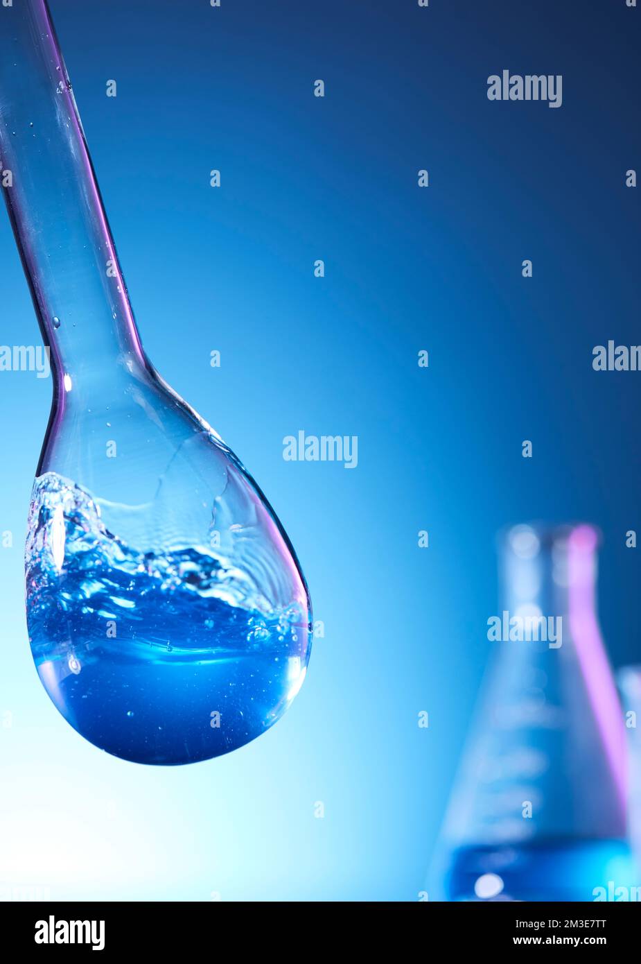 science lab with clear blue background and test tubes with blue ...