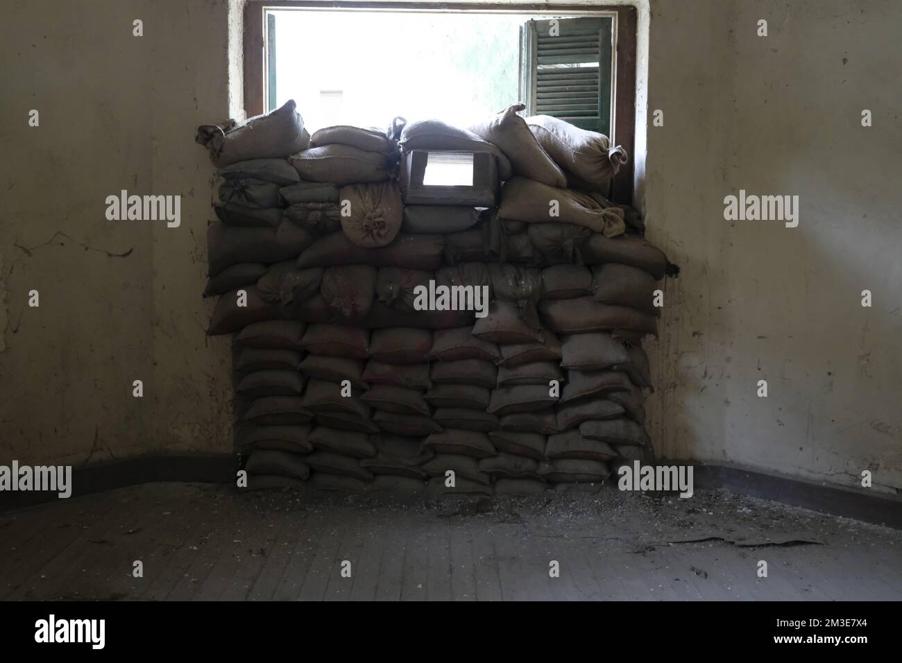 An abandoned house with sandbags at the window in Green Line in Nicosia ...