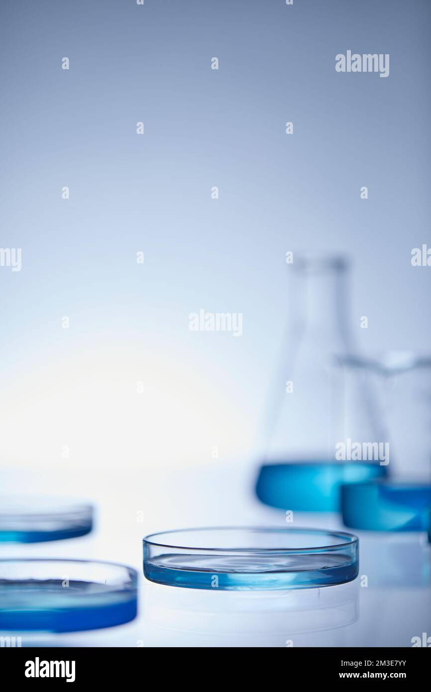 science lab with clear blue background and test tubes with blue ...