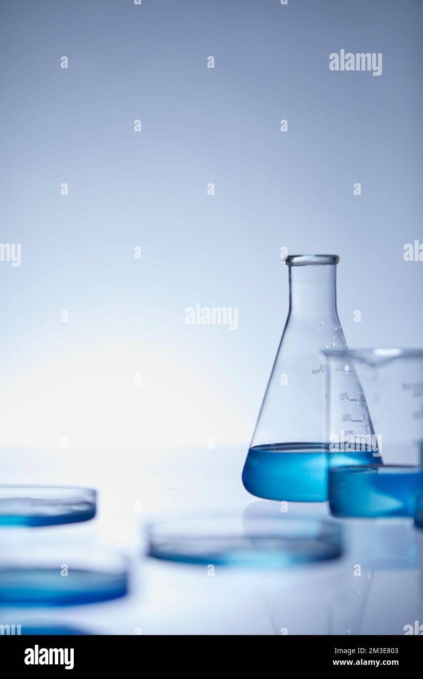 science lab with clear blue background and test tubes with blue ...