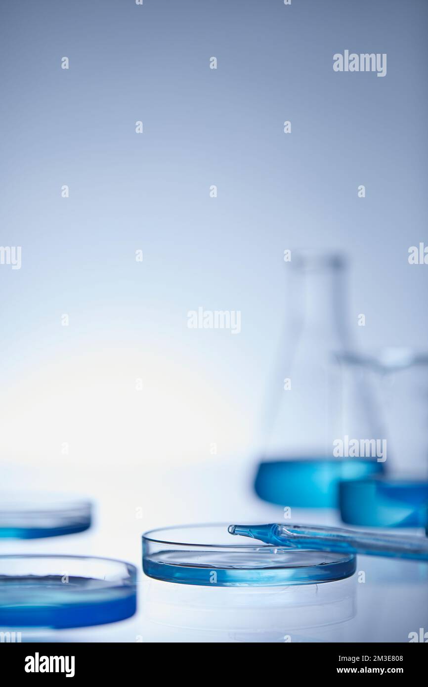 science lab with clear blue background and test tubes with blue ...