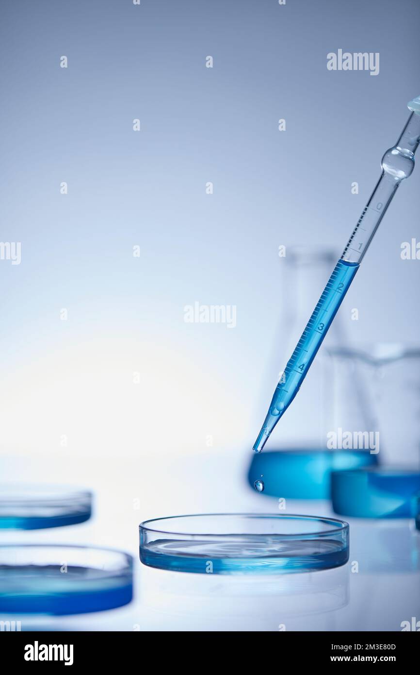 science lab with clear blue background and test tubes with blue ...