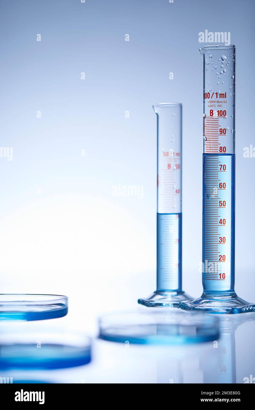 science lab with clear blue background and test tubes with blue ...
