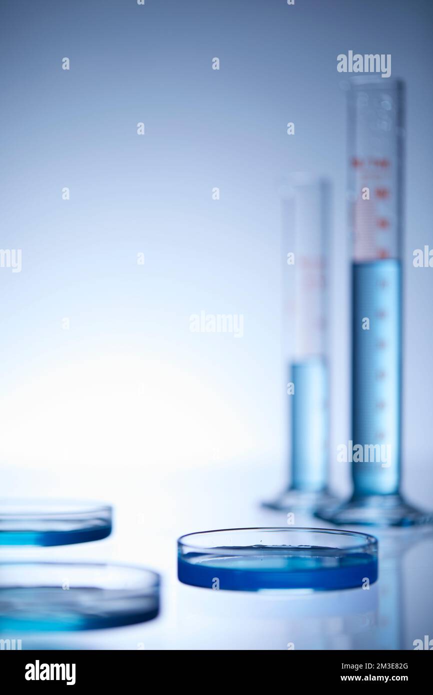 science lab with clear blue background and test tubes with blue ...