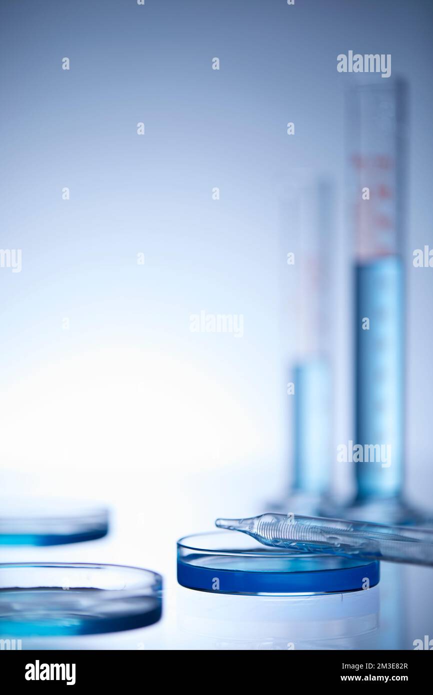 science lab with clear blue background and test tubes with blue ...