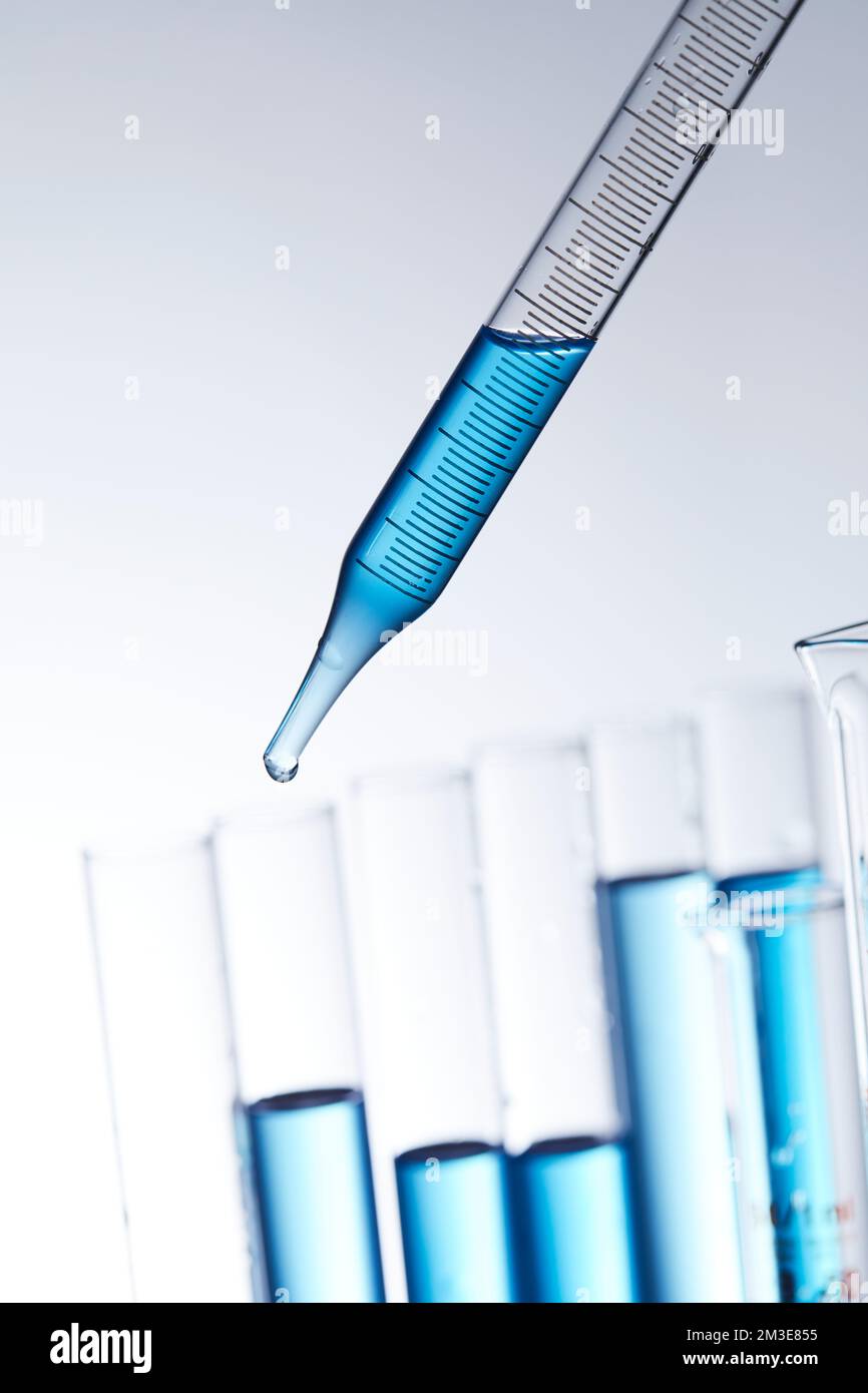 science lab with clear blue background and test tubes with blue ...