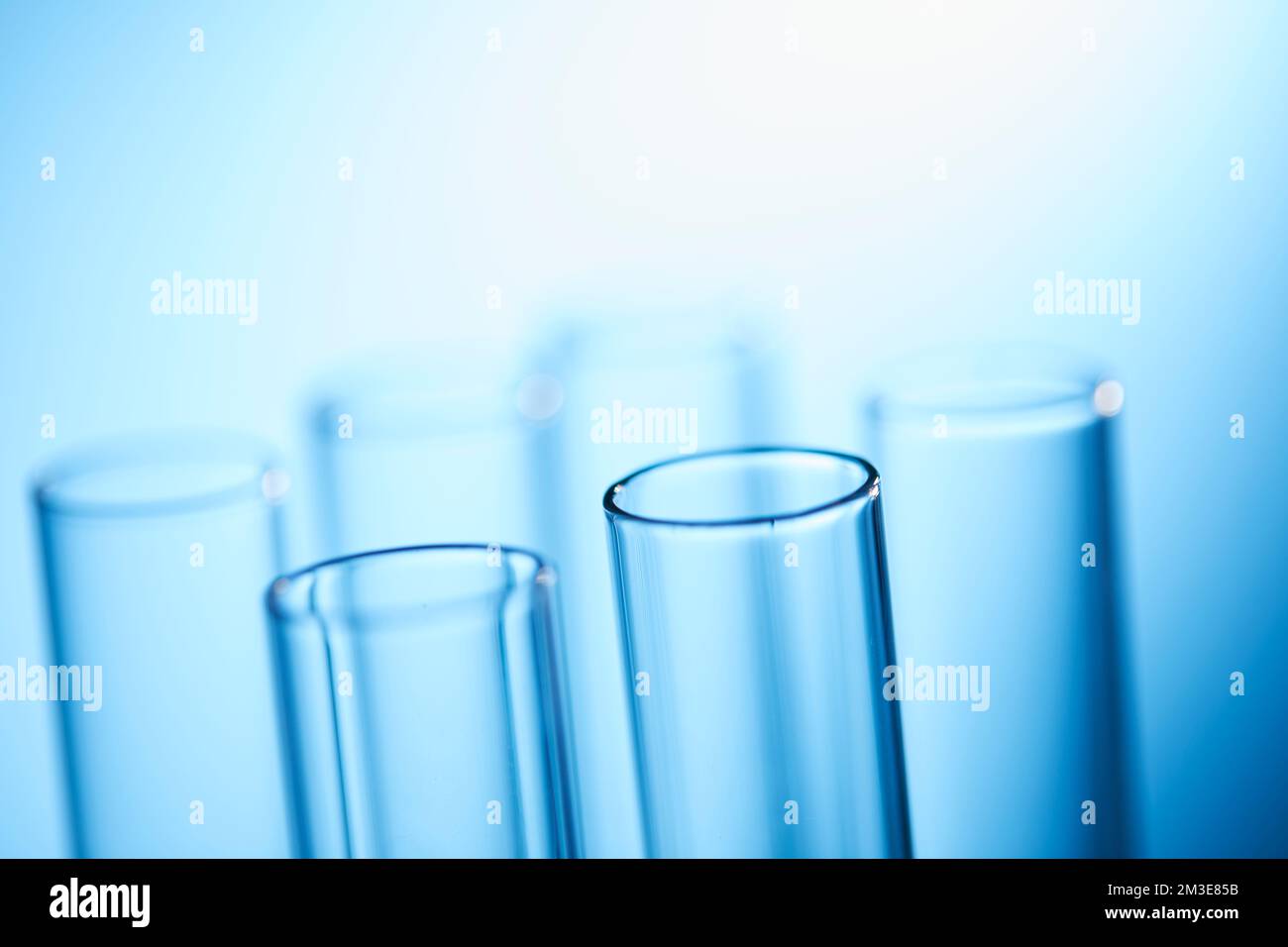 science lab with clear blue background and test tubes with blue ...