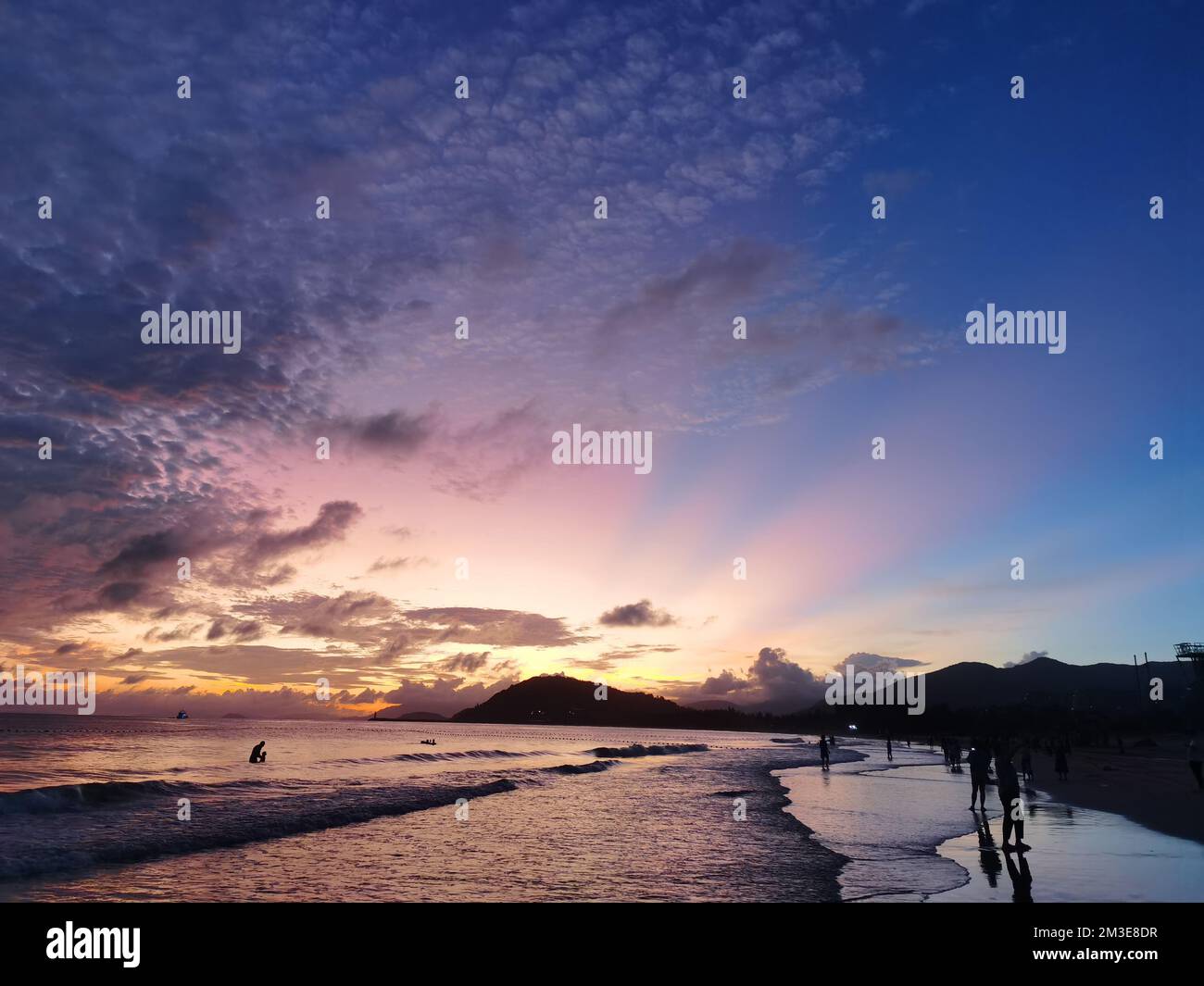 sunset on the beach with glow Stock Photo - Alamy