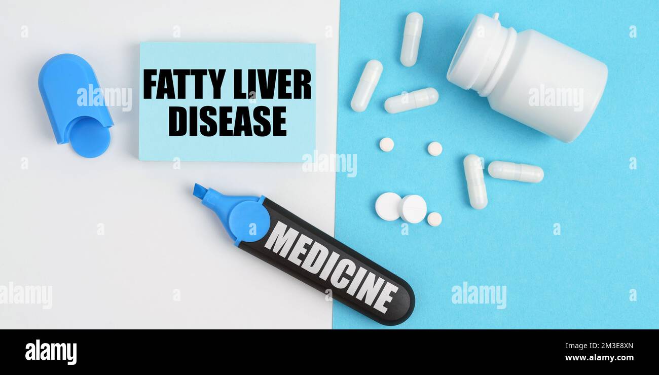 Medical concept. On the white and blue surface are pills, a marker and ...