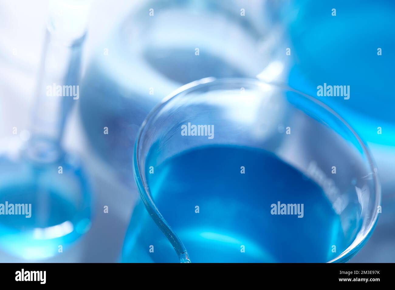 science lab with clear blue background and test tubes with blue ...