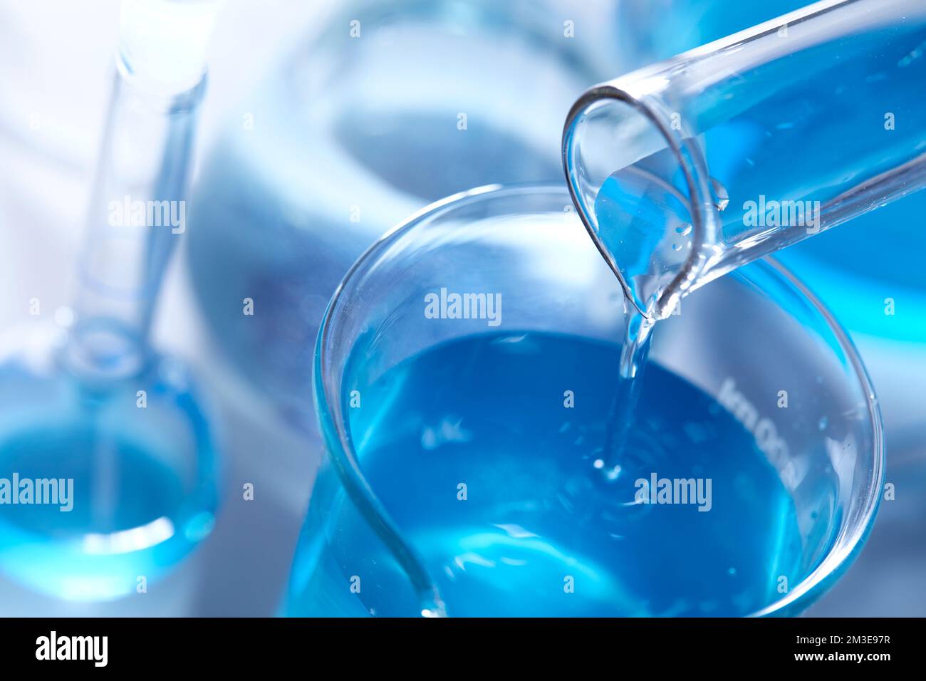 science lab with clear blue background and test tubes with blue ...