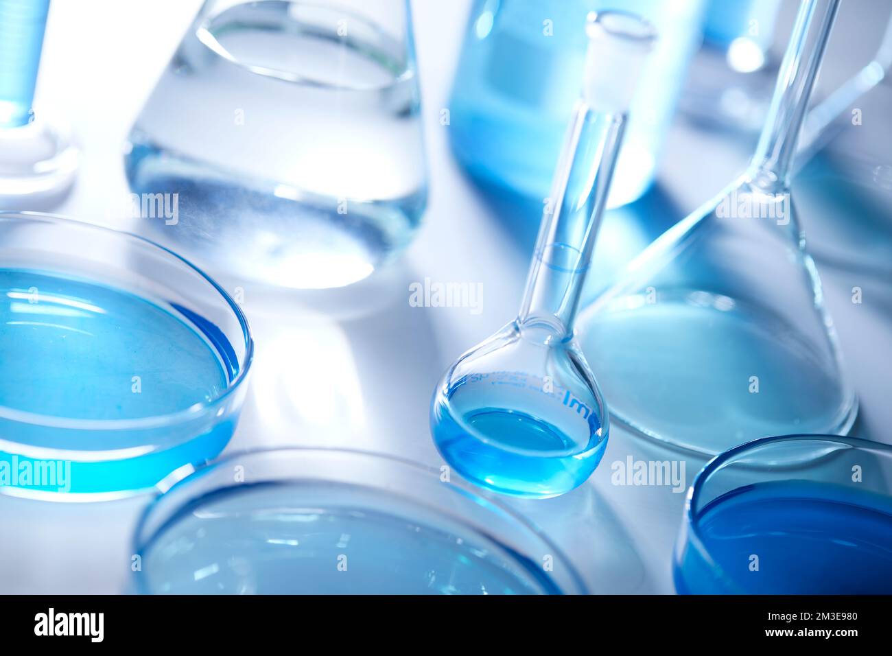 science lab with clear blue background and test tubes with blue ...