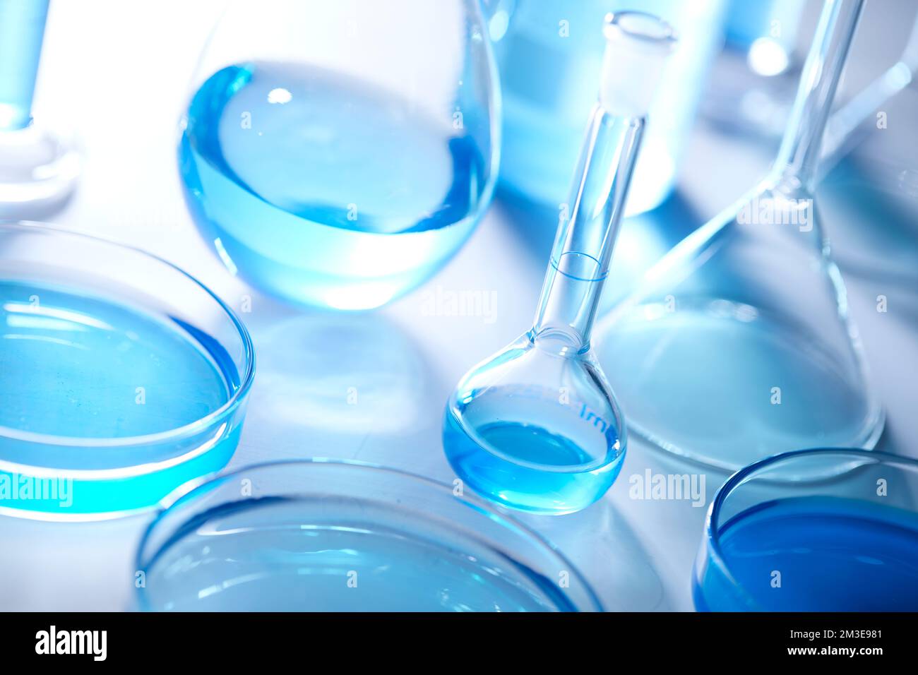 science lab with clear blue background and test tubes with blue ...