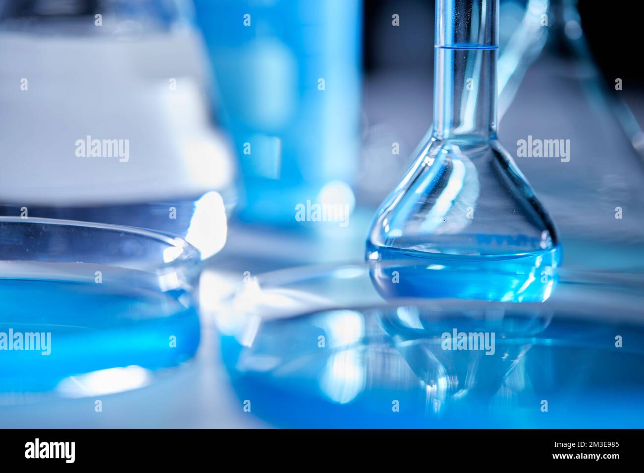 science lab with clear blue background and test tubes with blue ...