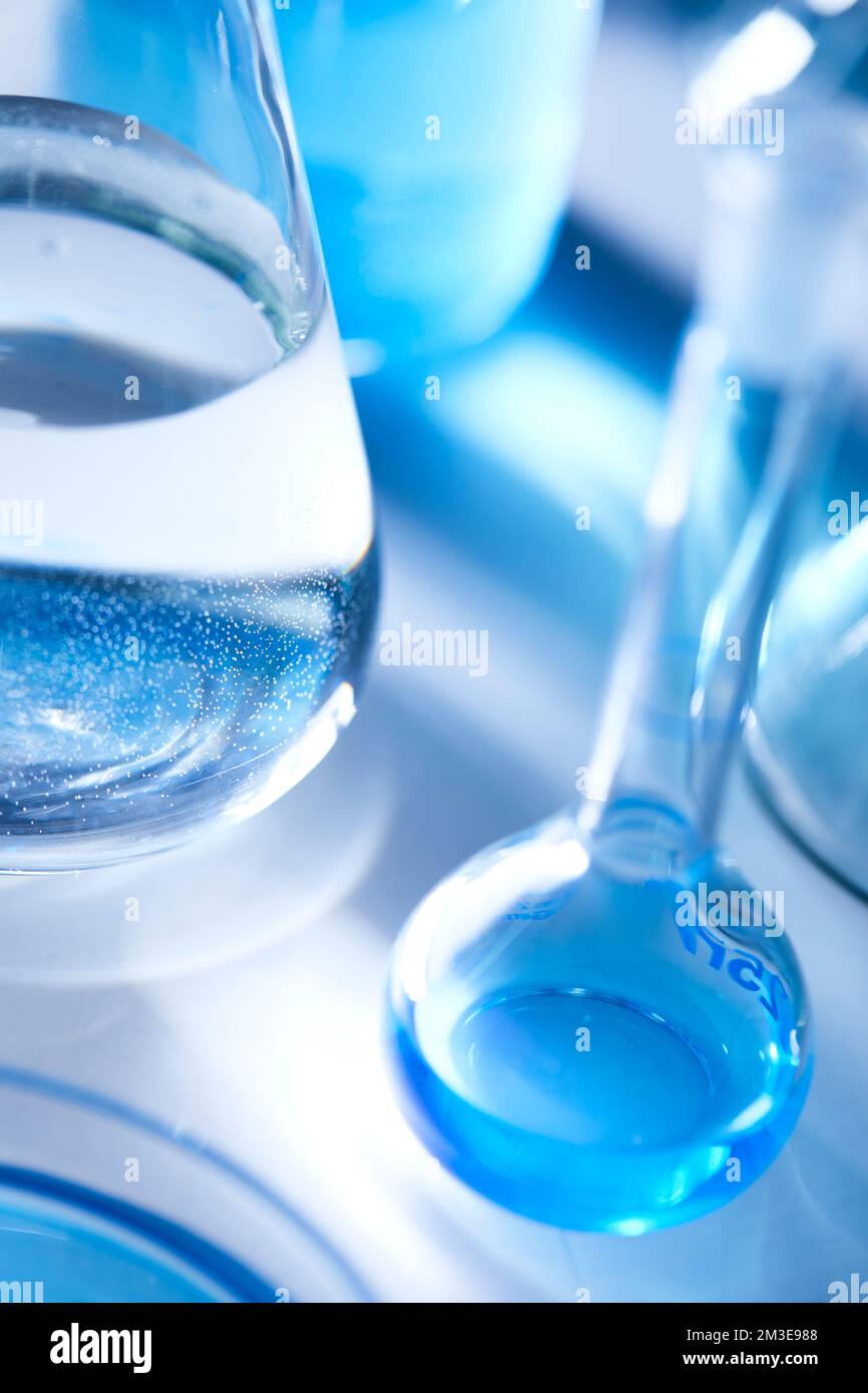 science lab with clear blue background and test tubes with blue ...