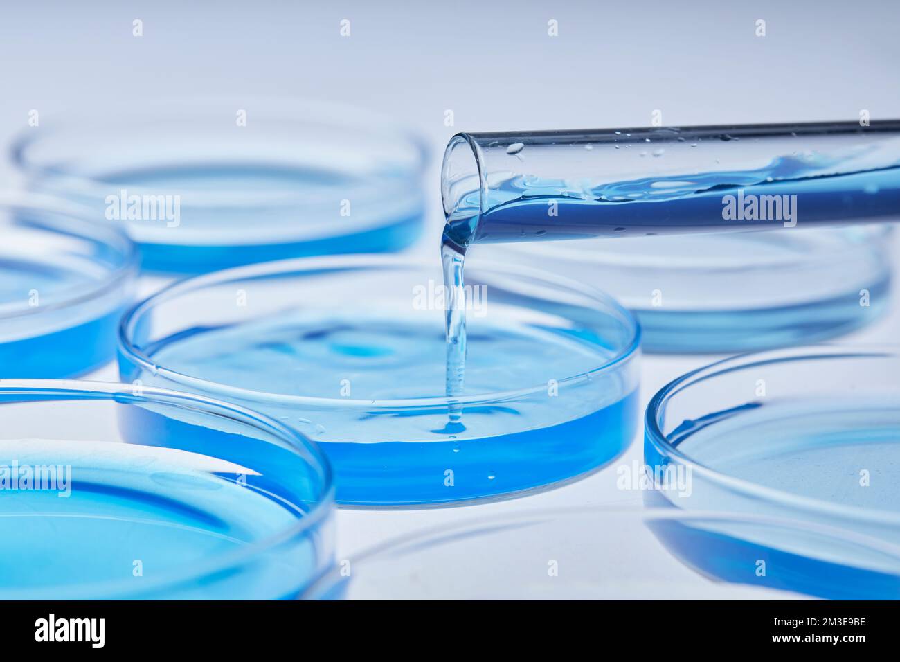 science lab with clear blue background and test tubes with blue ...