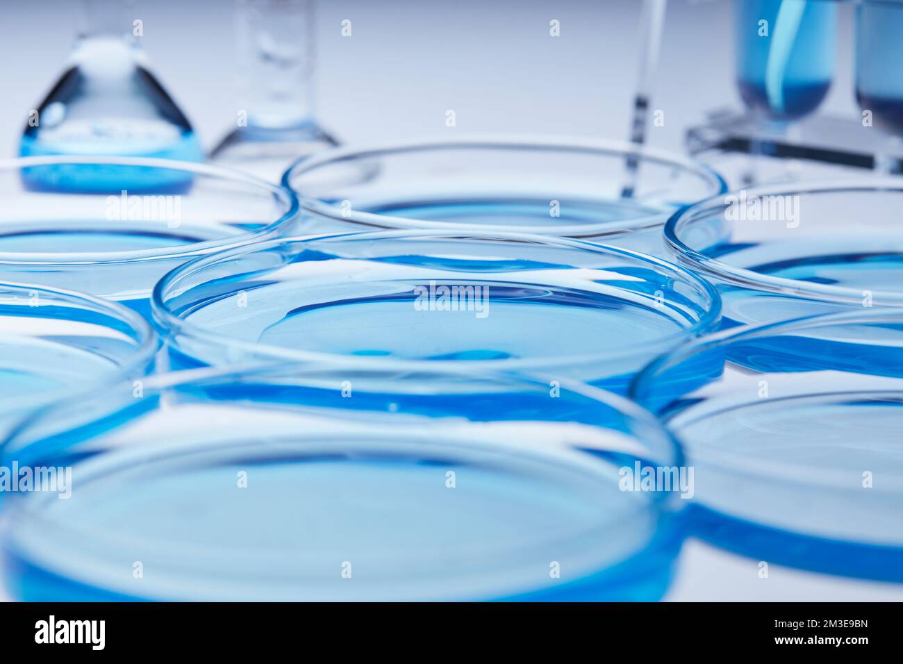 science lab with clear blue background and test tubes with blue ...