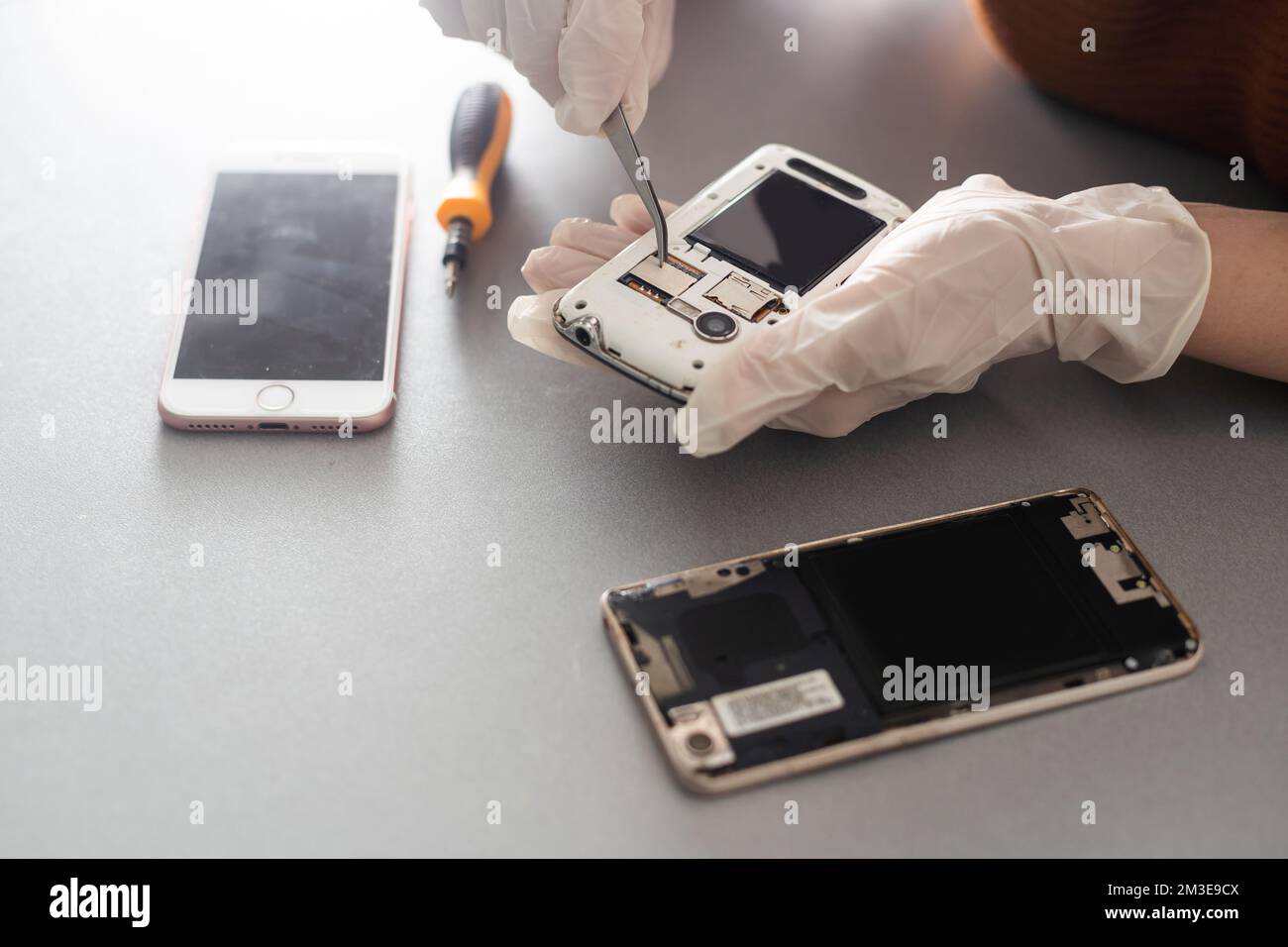 Close-up photos showing process of mobile phone repair Stock Photo - Alamy