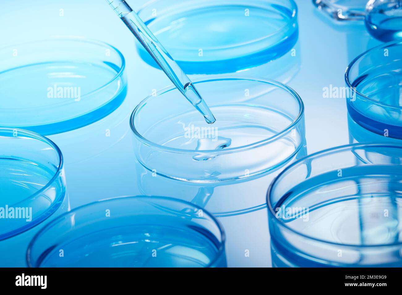 science lab with clear blue background and test tubes with blue ...