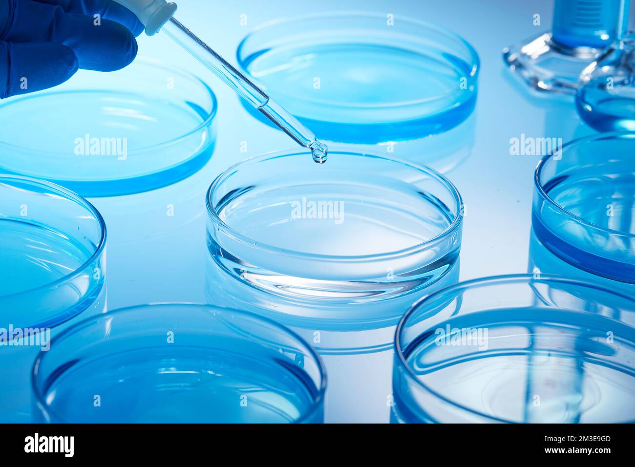 science lab with clear blue background and test tubes with blue ...