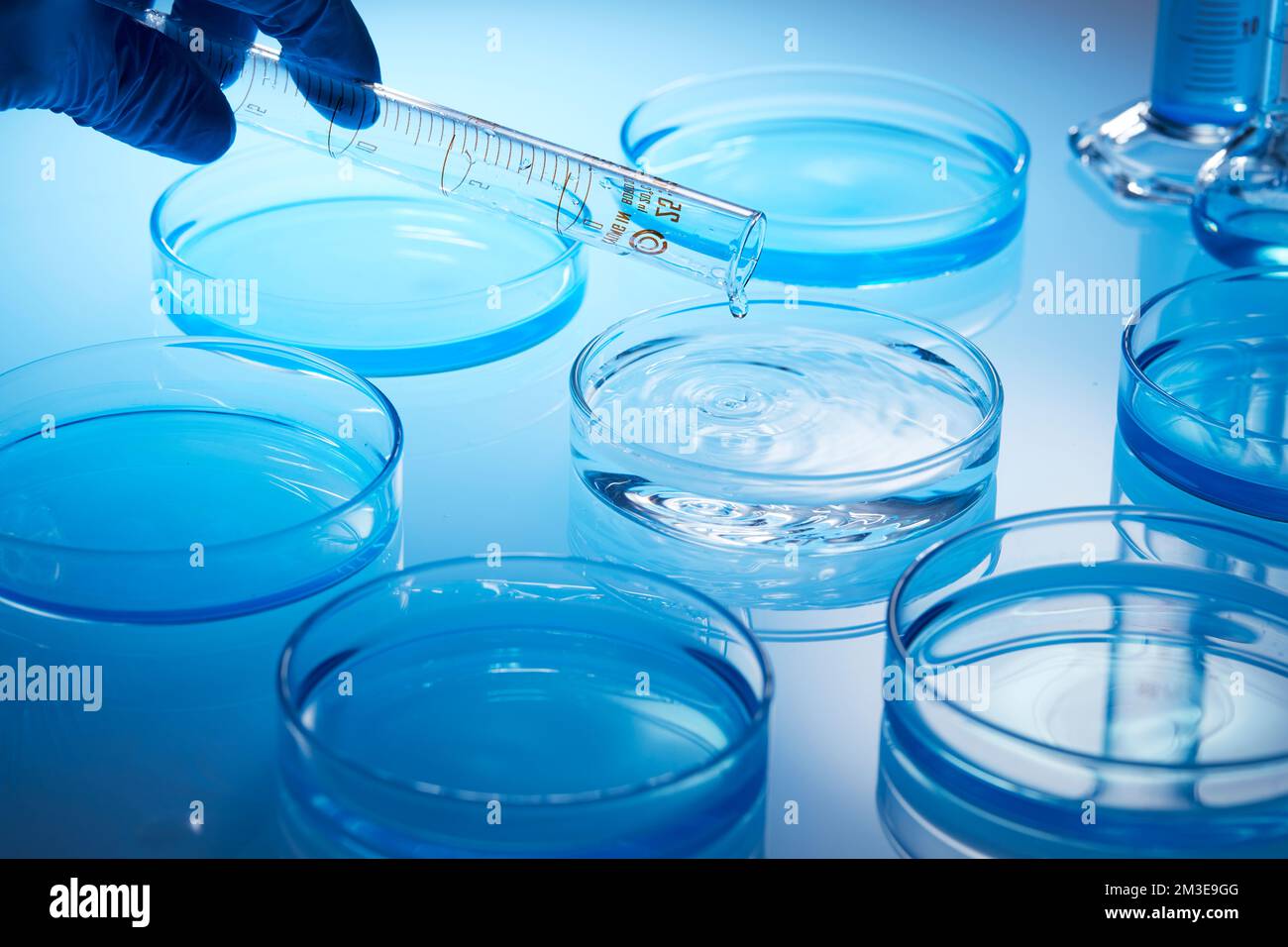 science lab with clear blue background and test tubes with blue ...