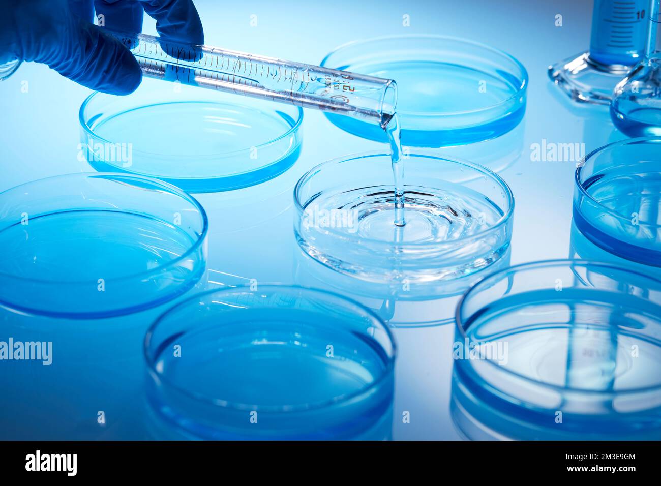 science lab with clear blue background and test tubes with blue ...