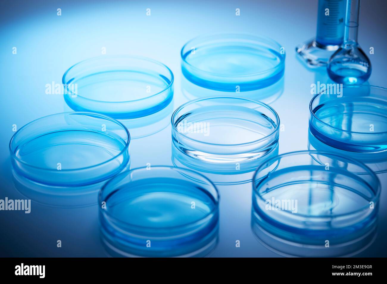 science lab with clear blue background and test tubes with blue ...