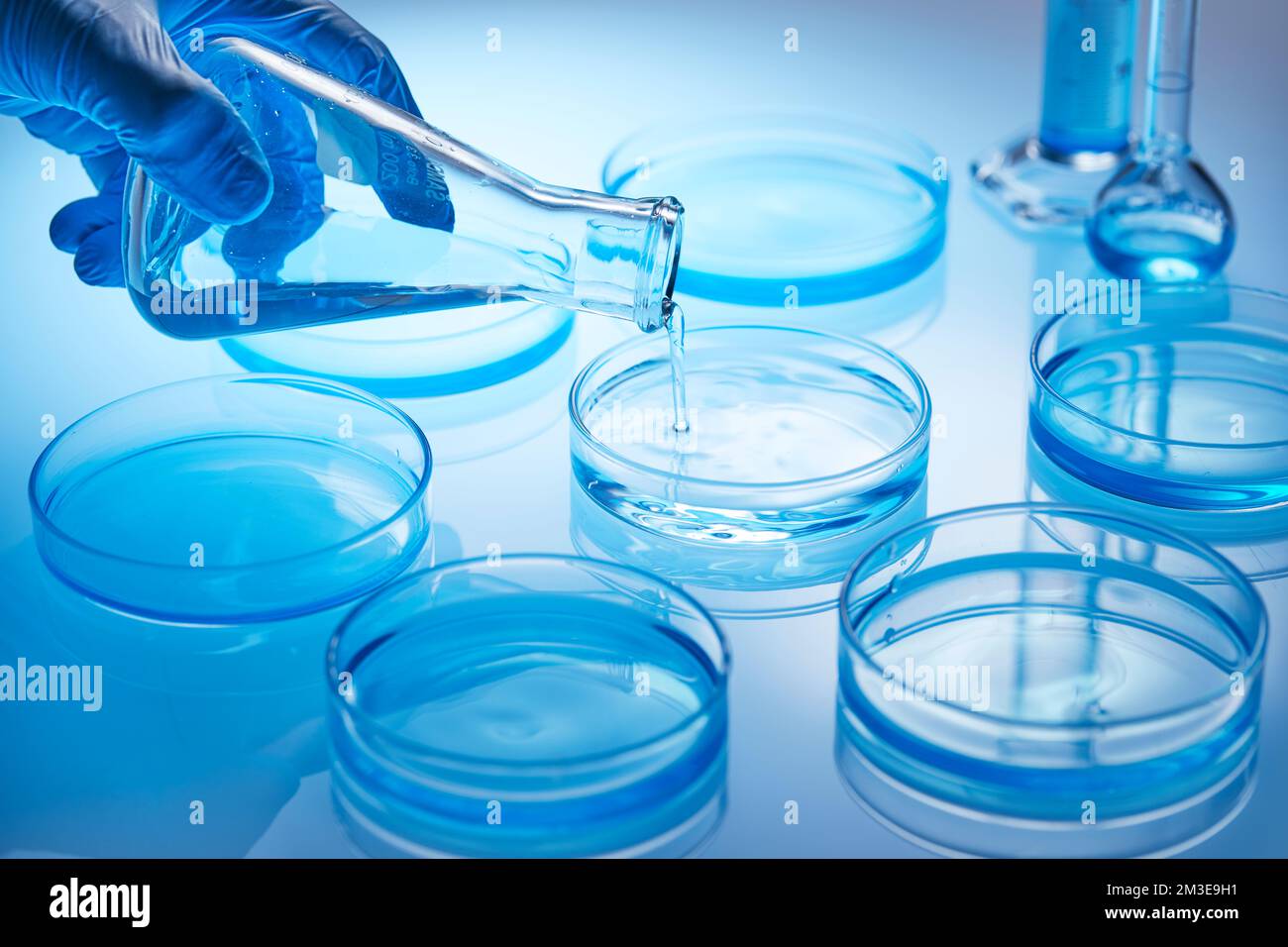 science lab with clear blue background and test tubes with blue ...