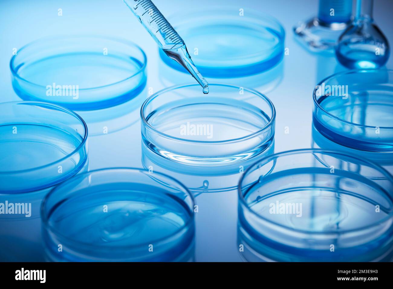 science lab with clear blue background and test tubes with blue ...
